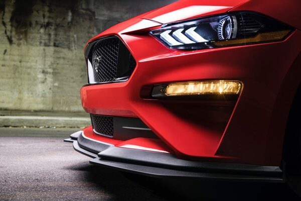 What is the purpose of car spoilers?